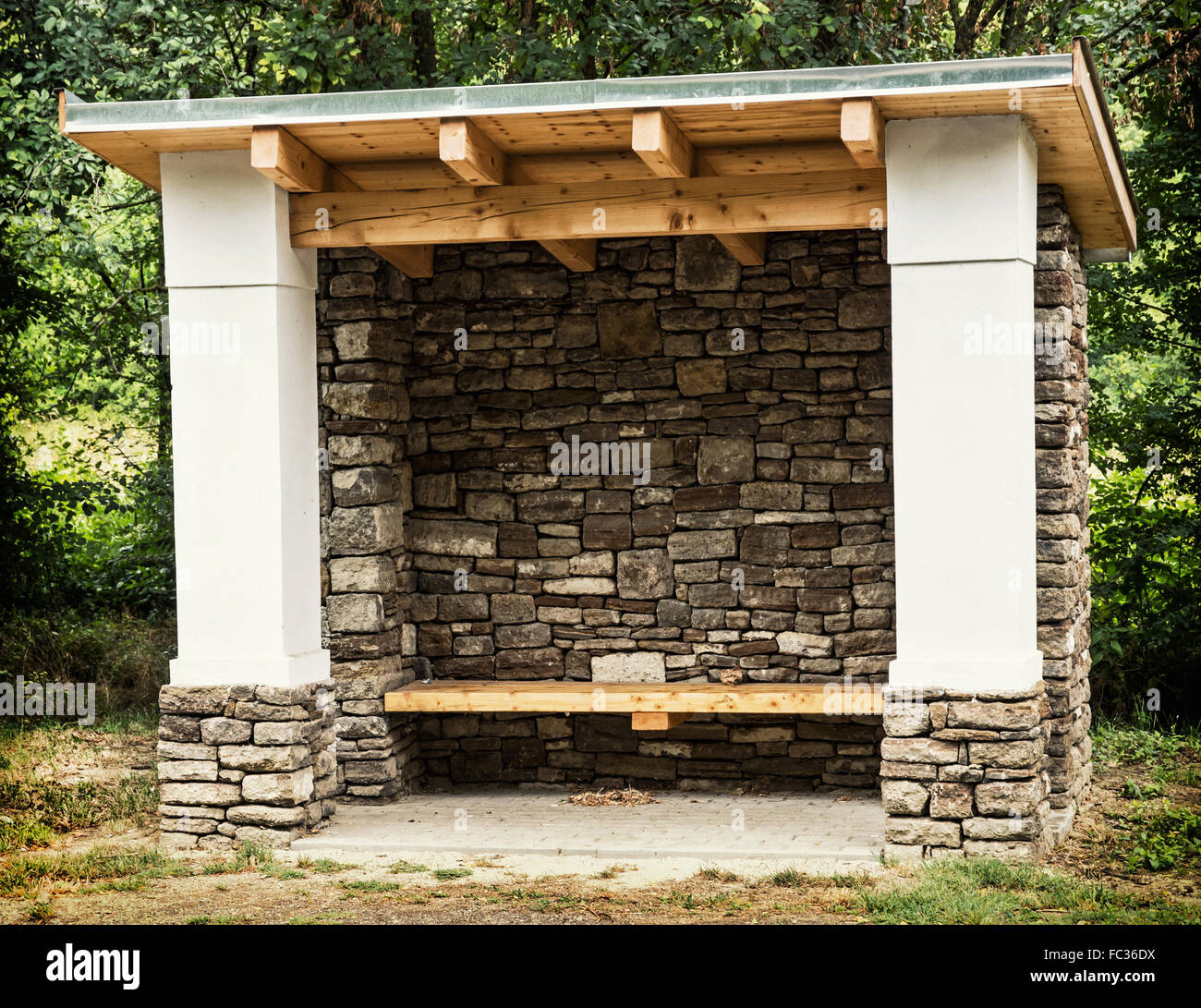 Rural bus stop of stone and wood. Empty transport station Stock Photo ...