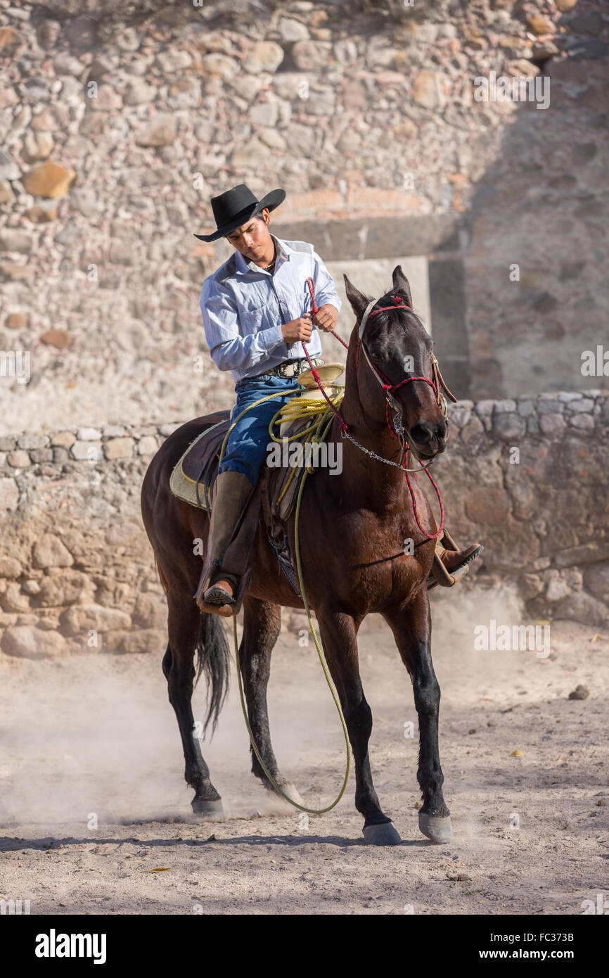 A Mexican charro or cowboy practices for Charreada competition at a ...