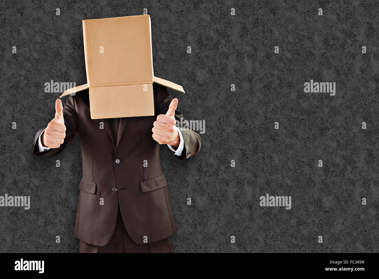 Composite image of anonymous businessman with thumbs up Stock Photo - Alamy