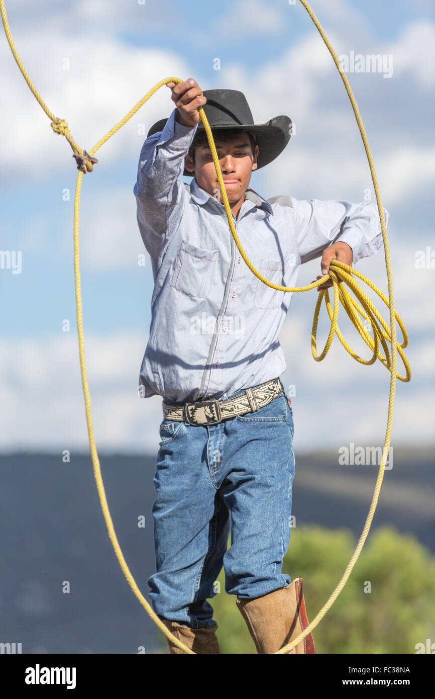 A Mexican charro or cowboy practices roping skills standing on his ...
