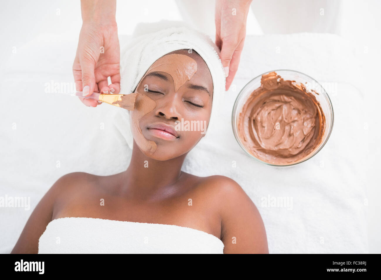 Pretty woman getting a chocolate facial treatment Stock Photo - Alamy