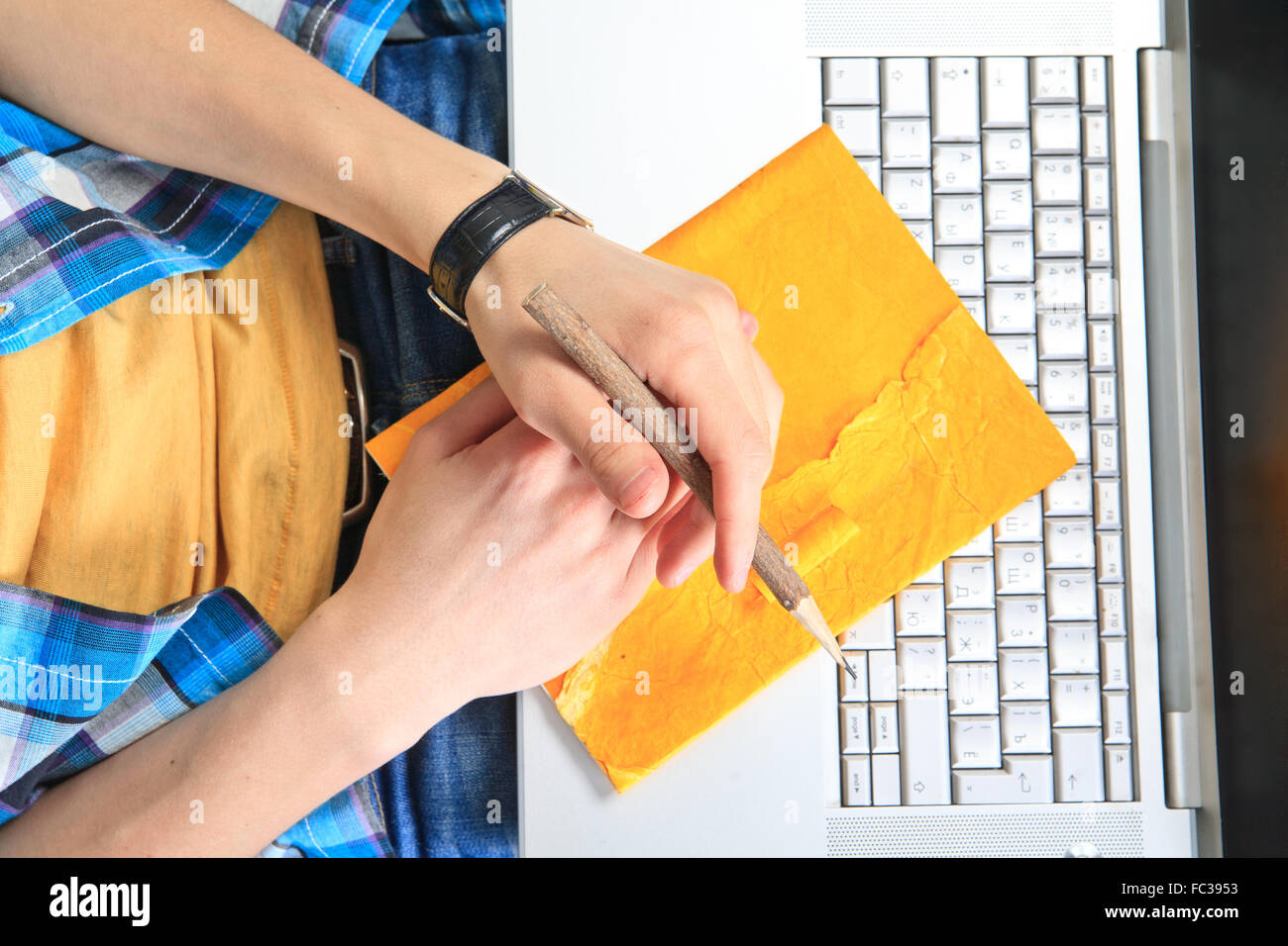 Hand and notebook. Close up Stock Photo - Alamy