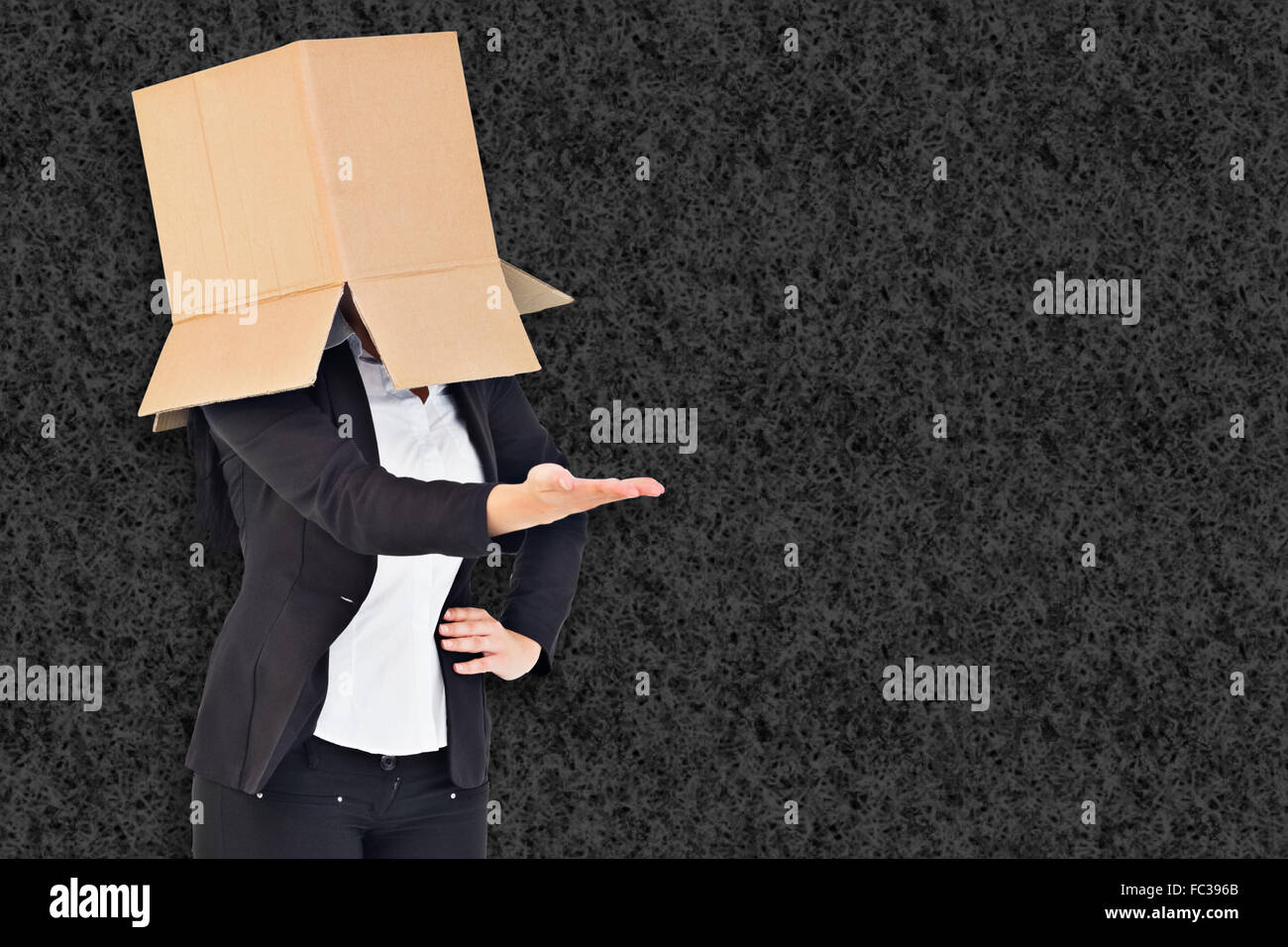 Composite image of businesswoman presenting with box over head Stock ...