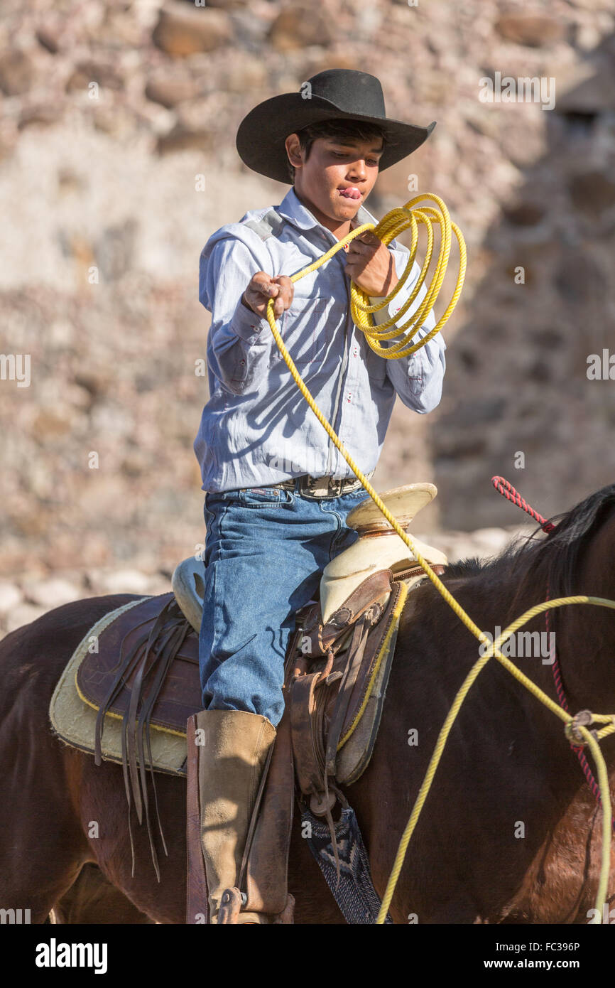 A Mexican charro or cowboy practices roping skills before a Charreada ...