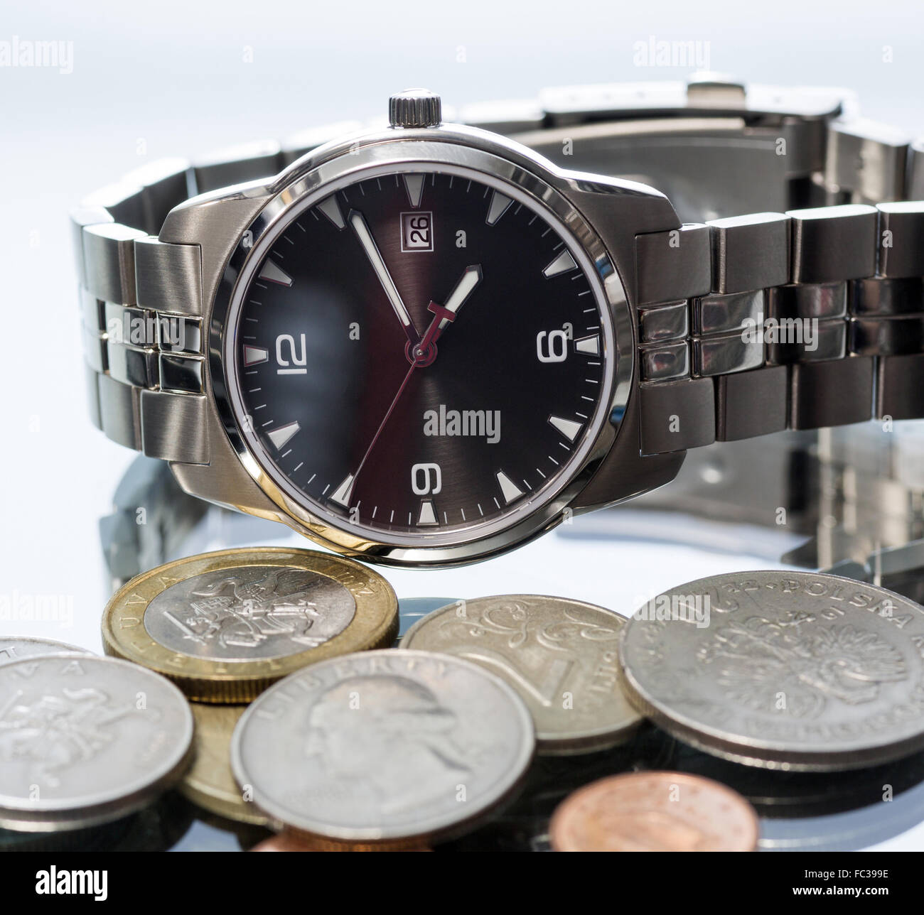 wrist watch. coin Stock Photo - Alamy