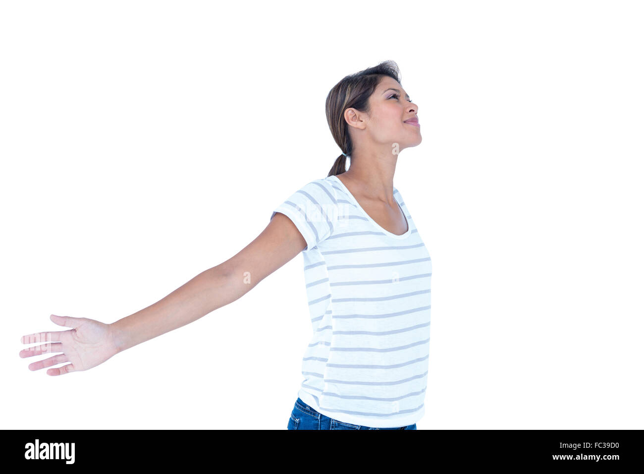 Side view of pretty brunette with arms outstretched Stock Photo - Alamy