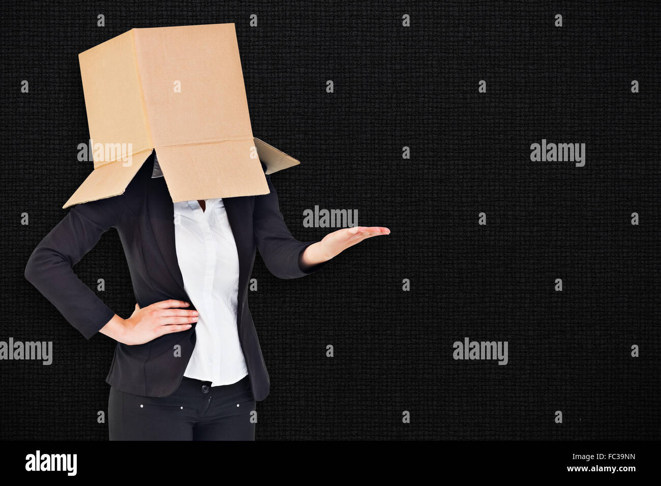 Composite image of businesswoman showing thumbs up with box over head ...