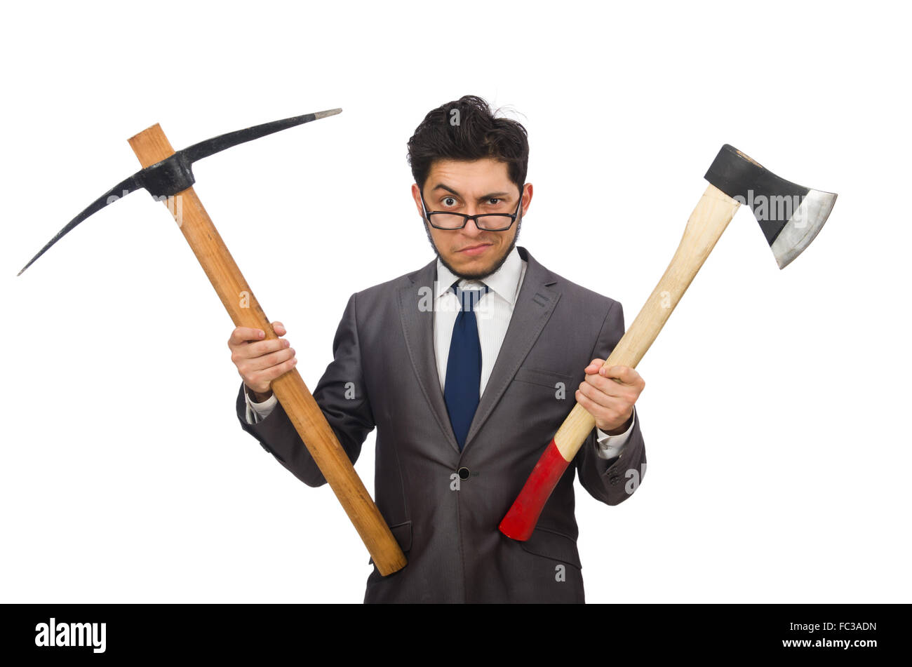 Young businessman holding a tool isolated on white Stock Photo - Alamy