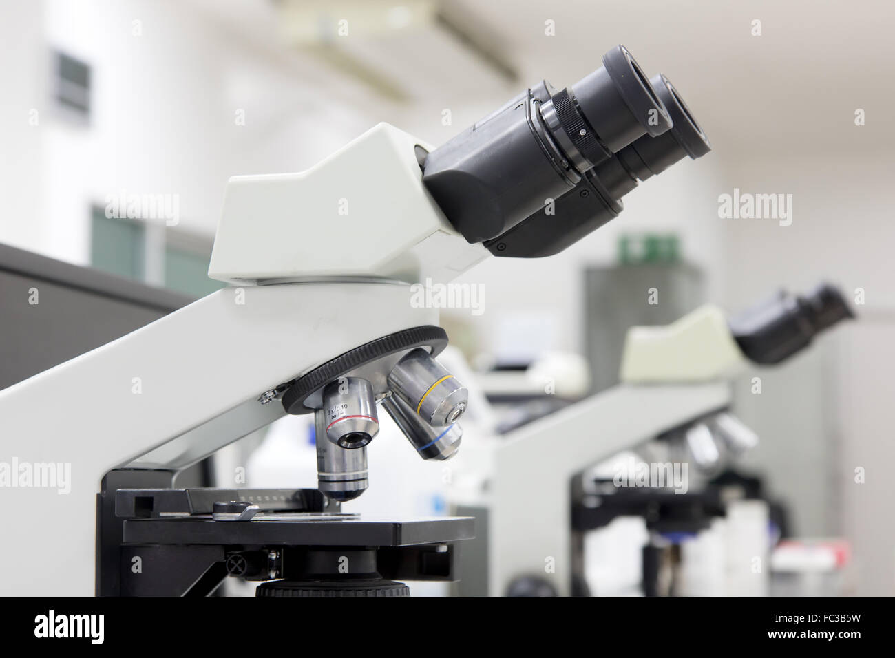 microscope on table in laboratory Stock Photo - Alamy