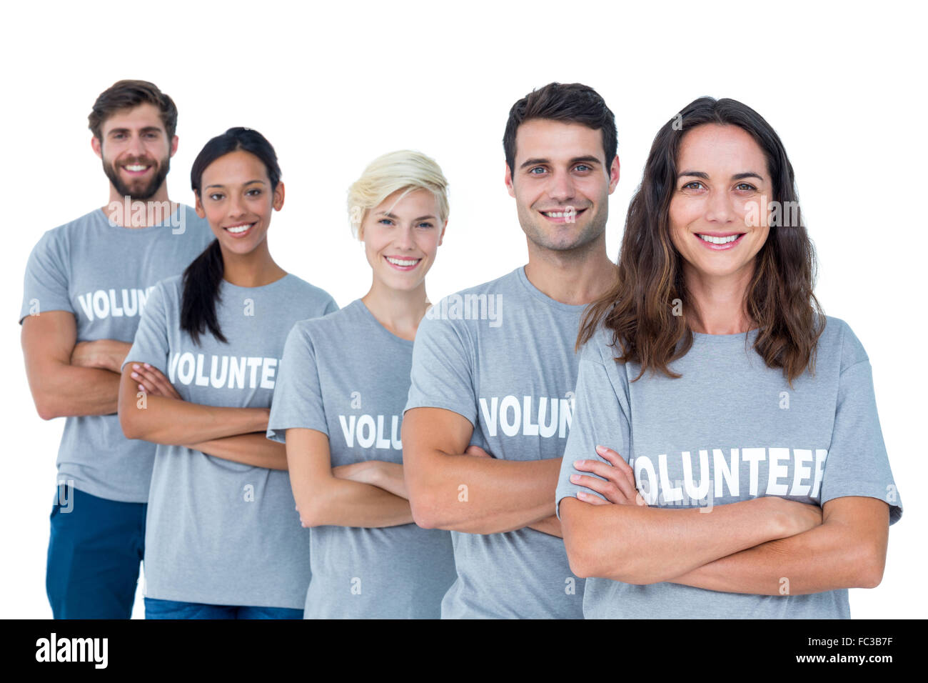 Happy volunteers friends smiling to the camera Stock Photo - Alamy