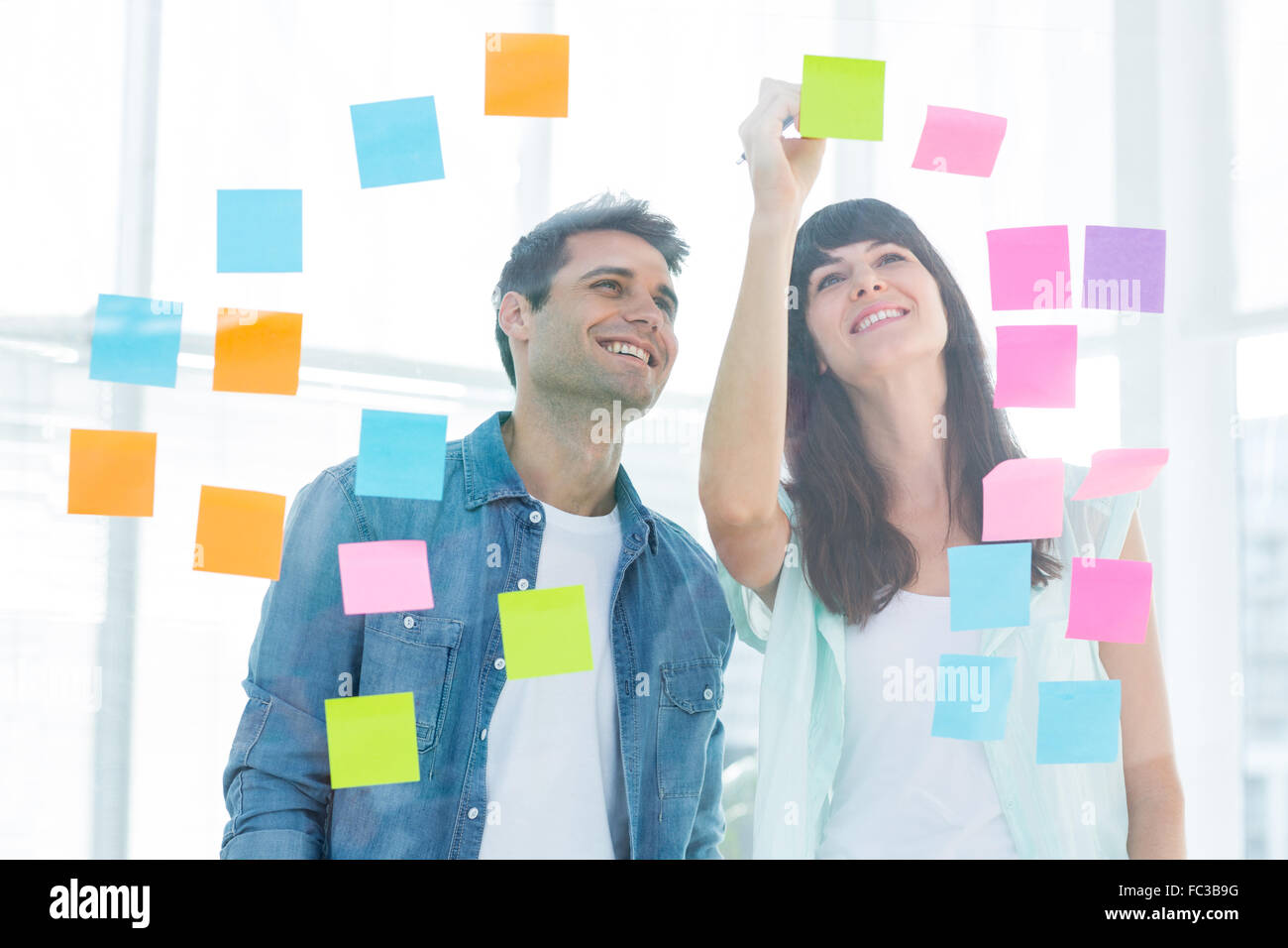 Young creative business people writing photo editor Stock Photo - Alamy