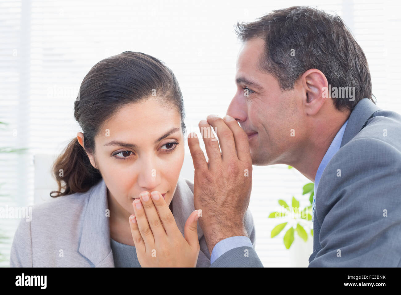 Whisper ear man work hi-res stock photography and images - Alamy