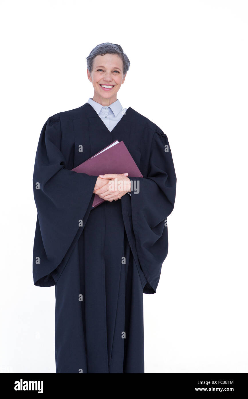 Happy lawyer looking at camera and holding law code Stock Photo - Alamy