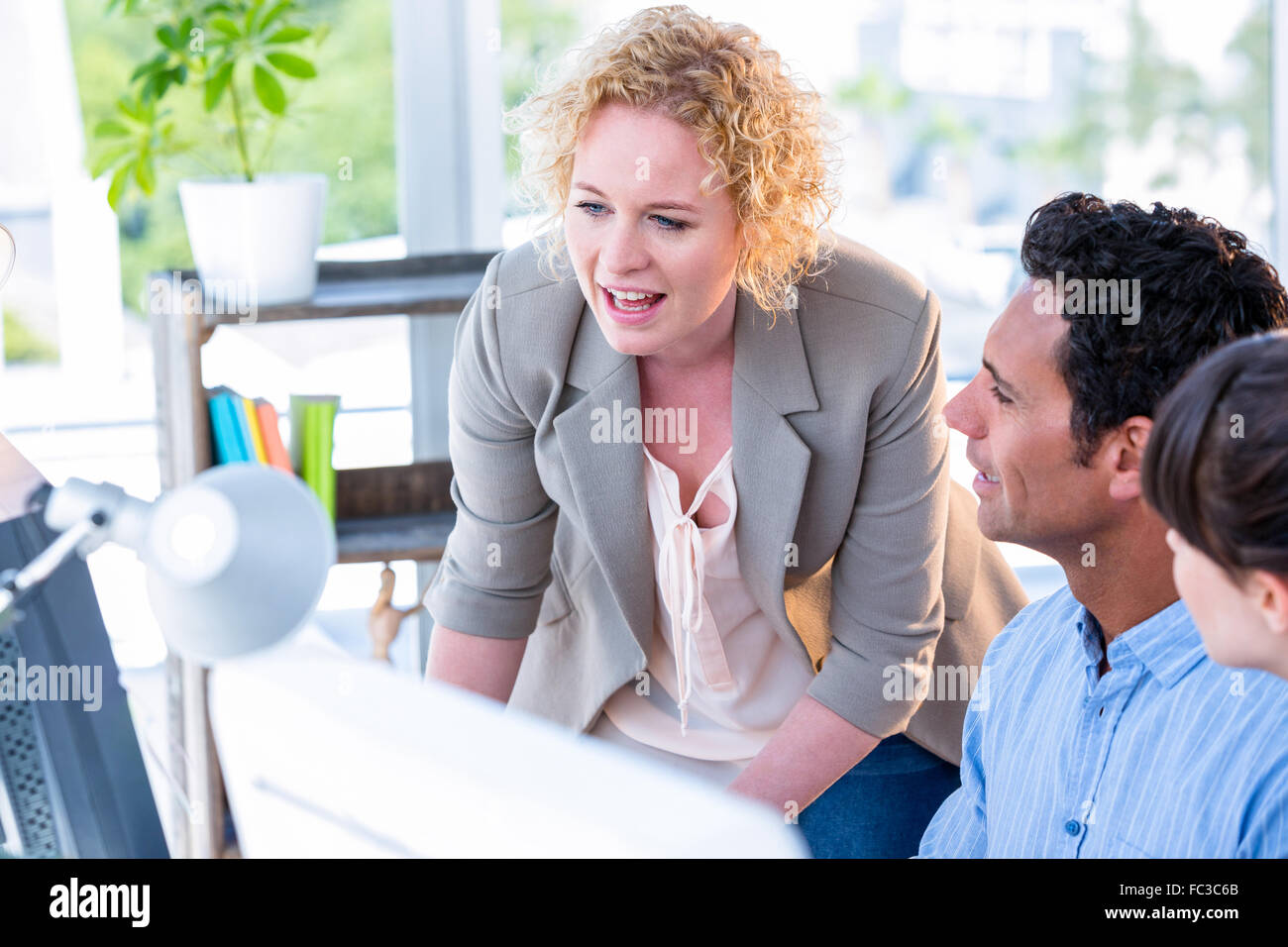 Creative business people working together on computer Stock Photo - Alamy