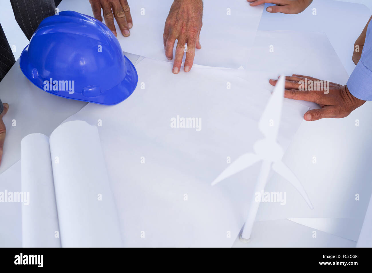 team of business people looking at construction plan Stock Photo - Alamy