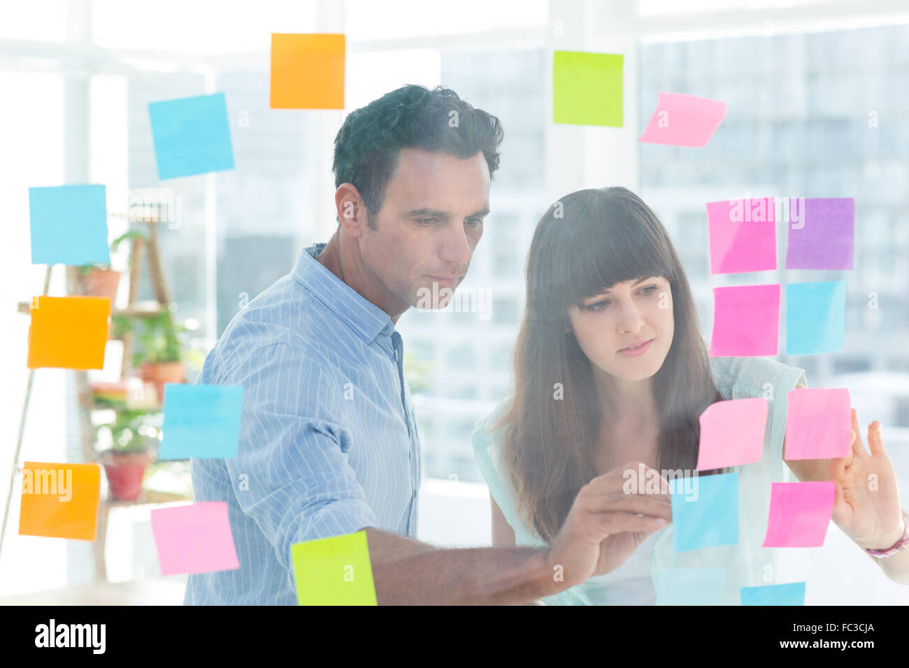 Young creative business people writing photo editor Stock Photo - Alamy