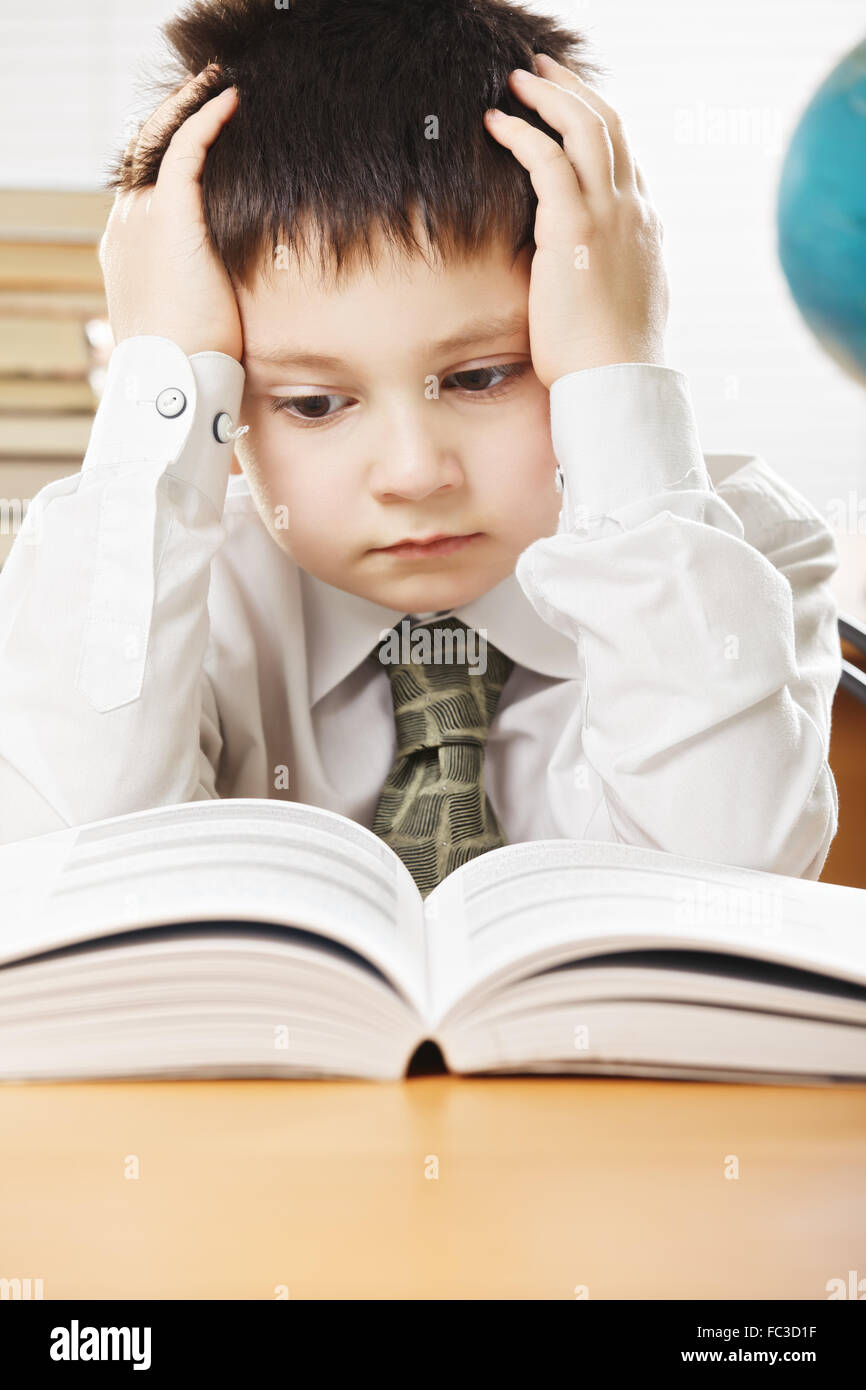 Boy having hard reading Stock Photo - Alamy