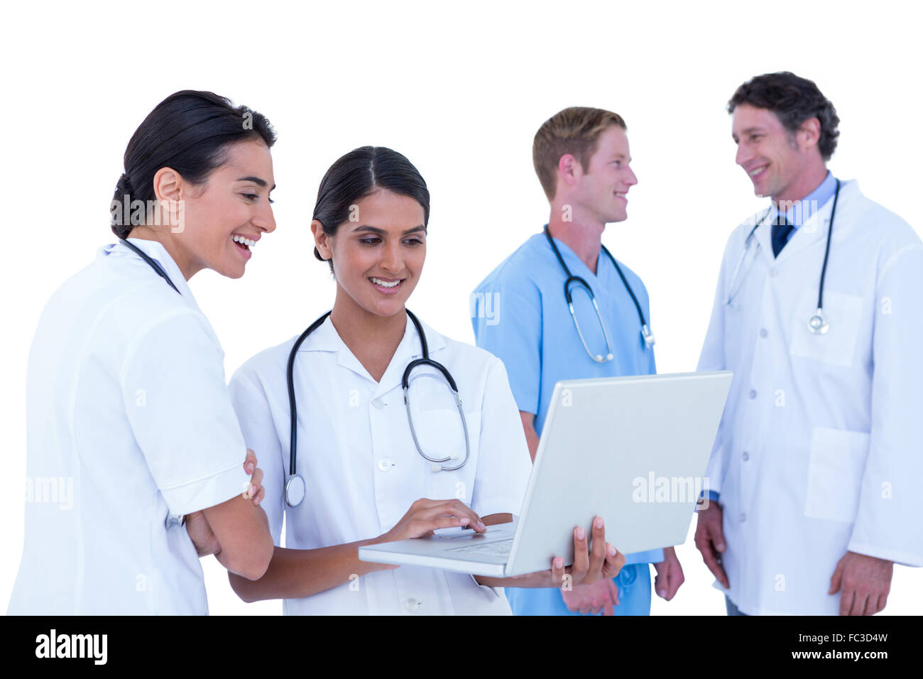 Doctors and nurses discussing and using laptop Stock Photo - Alamy