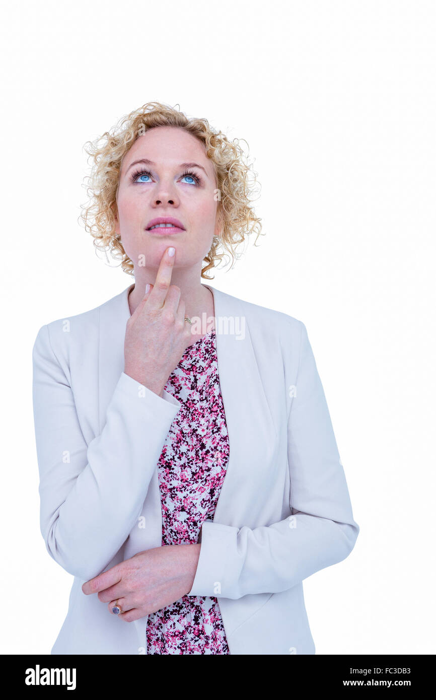 Thoughtful hipster looking up with finger on chin Stock Photo - Alamy