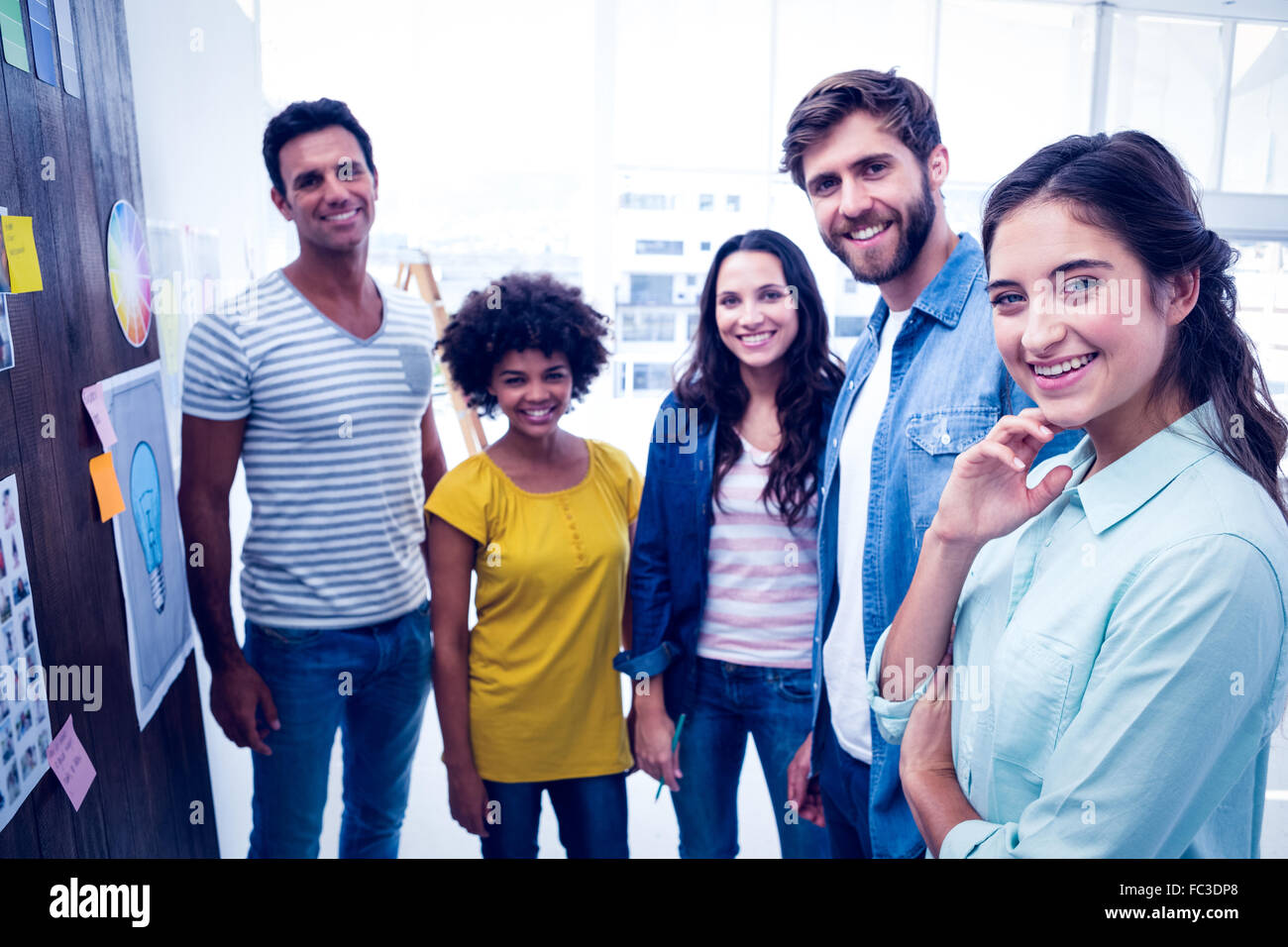 Young creative business people at work by blackboard Stock Photo - Alamy