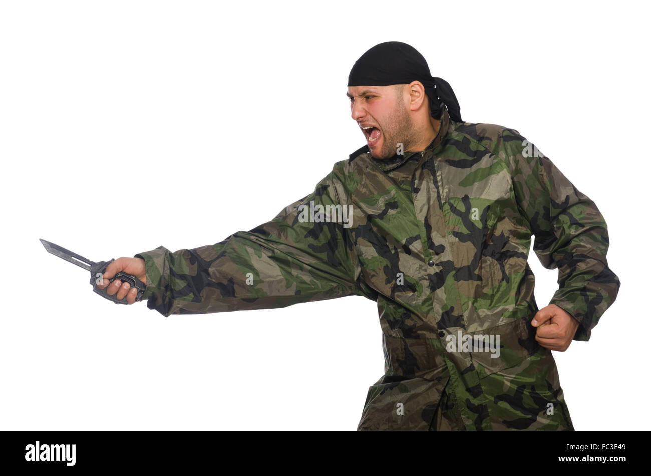 Young man in soldier uniform holding knife isolated on white Stock ...