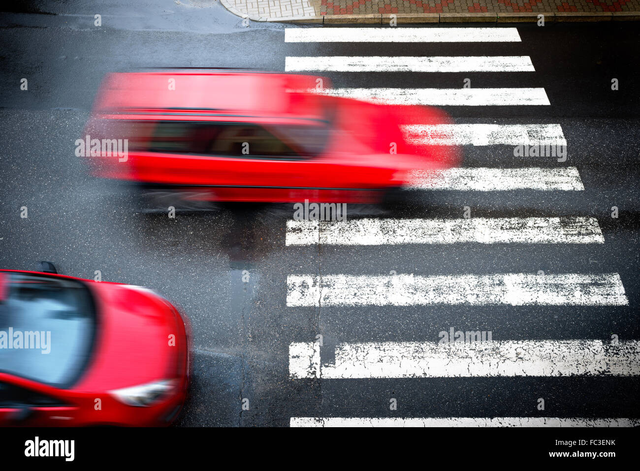 two red cars on the pedestrian crossing Stock Photo - Alamy