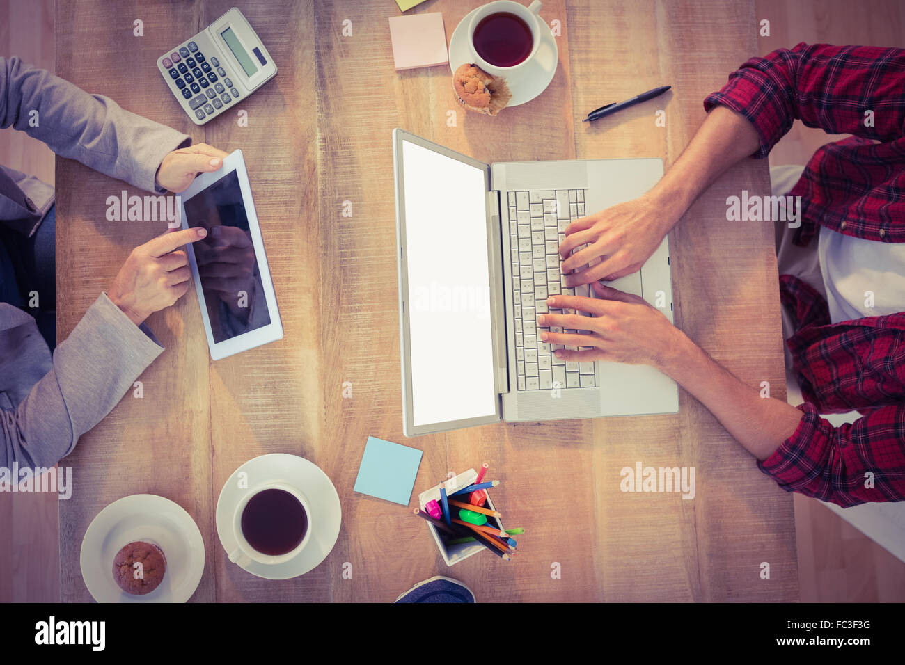 Creative businessmen working on electronic devices Stock Photo - Alamy