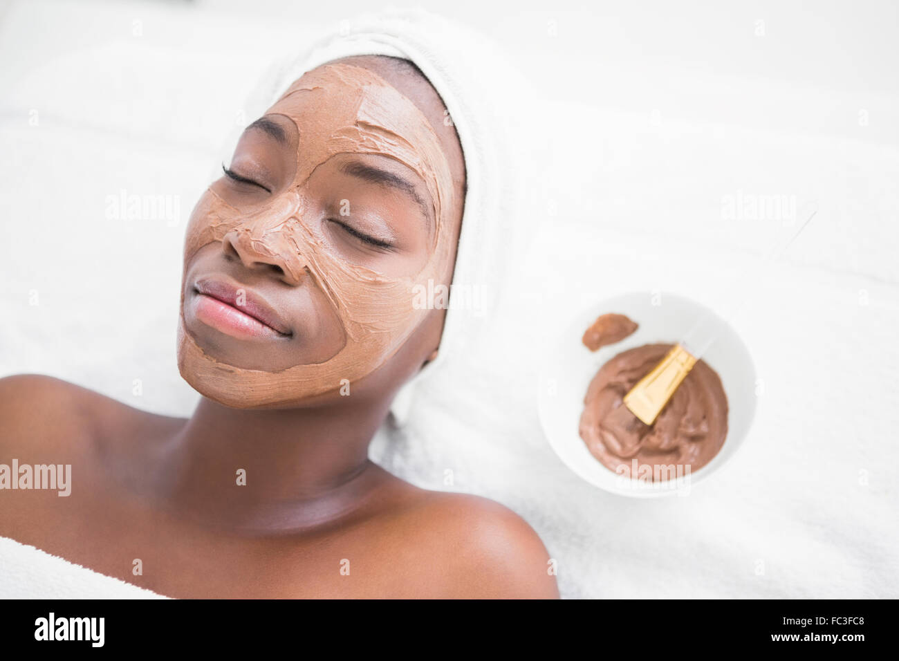 Pretty woman enjoying a chocolate facial treatment Stock Photo - Alamy