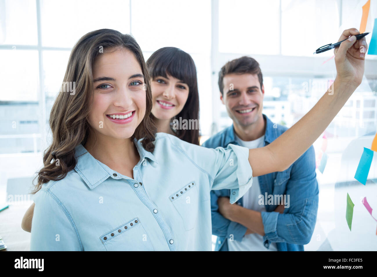Young creative business people writing photo editor Stock Photo - Alamy