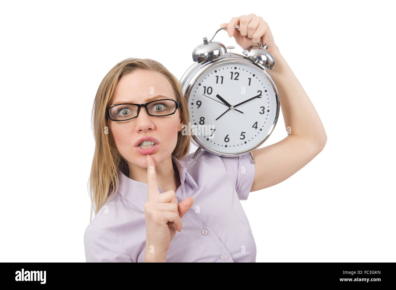 Young employee holding alarm clock isolated on white Stock Photo - Alamy