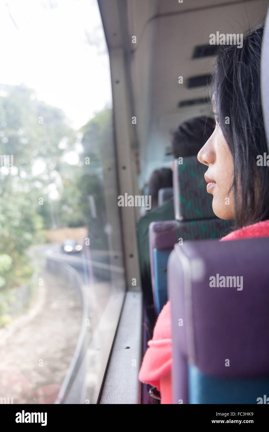 woman in a bus looking out the window Stock Photo - Alamy