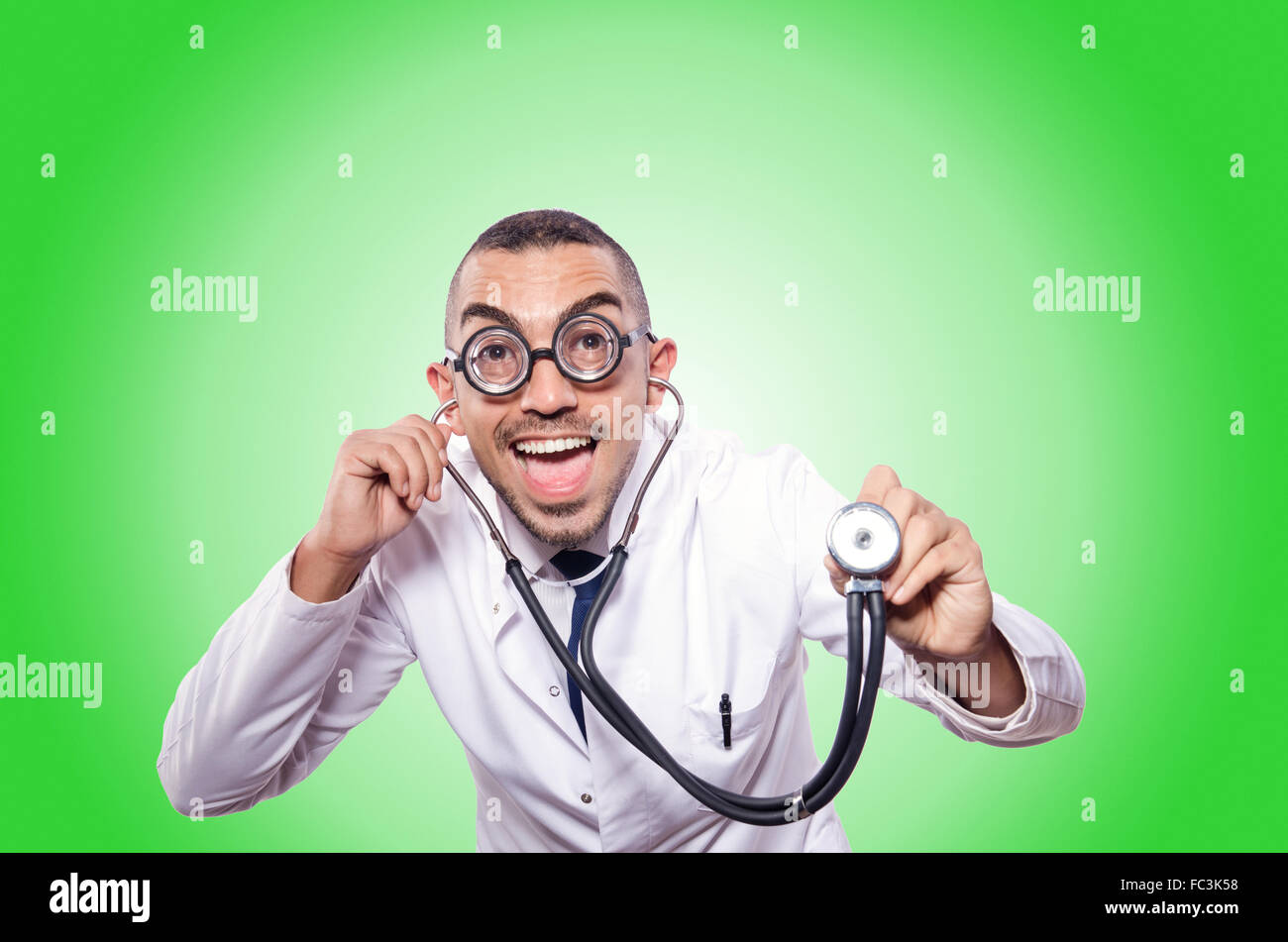 Funny doctor isolated on the white Stock Photo - Alamy