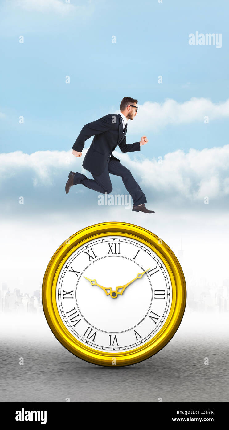Composite image of geeky young businessman running mid air Stock Photo ...