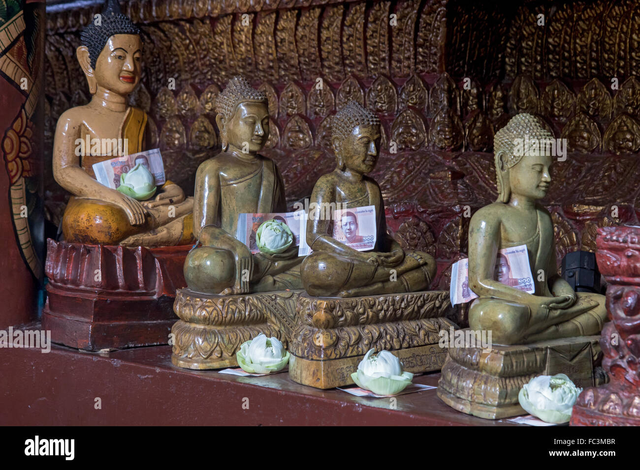 Statues of Buddha at Buddhist monastery Wat Phnom Stock Photo - Alamy