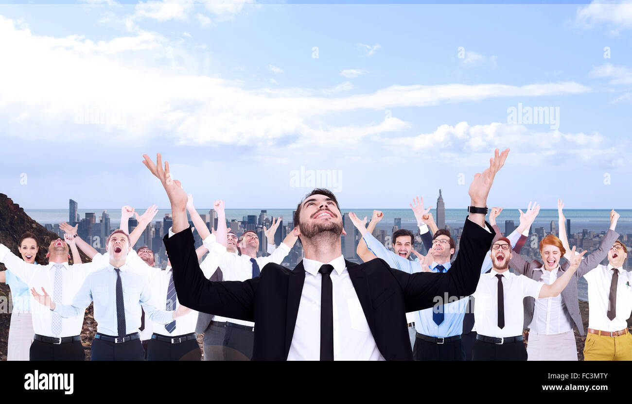 Composite image of businessman cheering with hands raised Stock Photo ...
