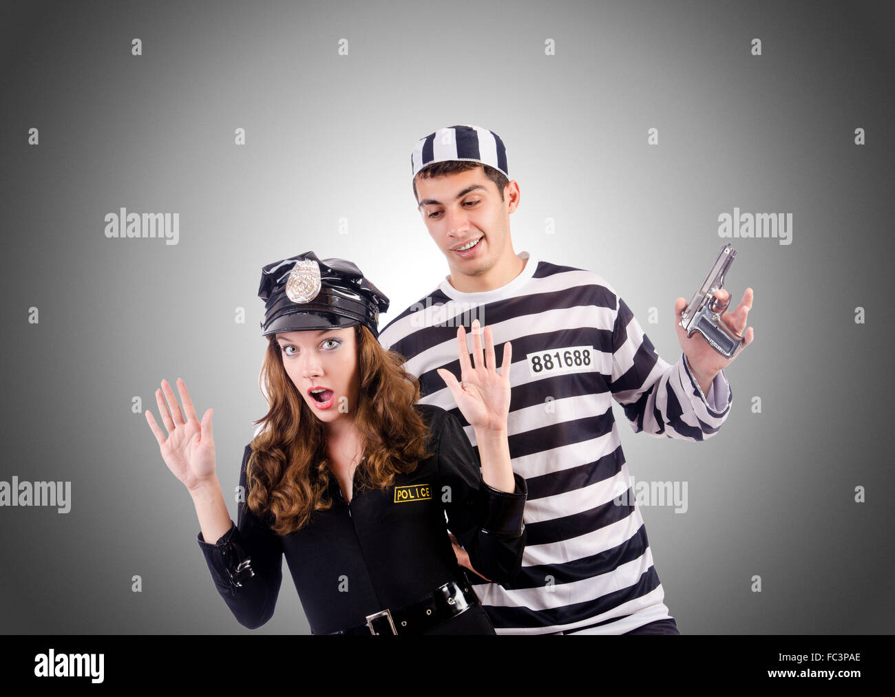 Police and prison inmate against the gradient Stock Photo - Alamy