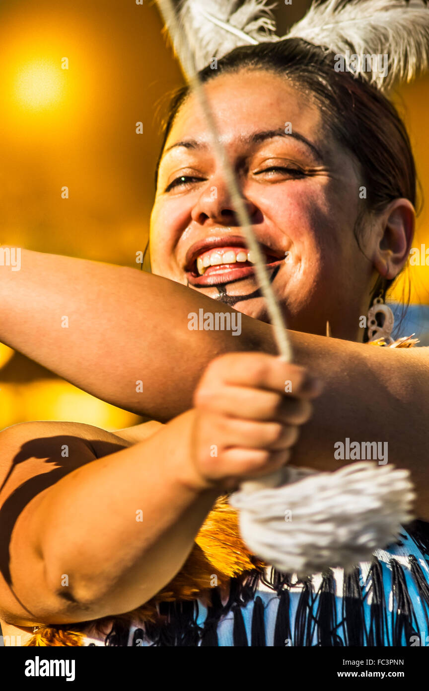 Smiling Maori woman performing the haka (war dance) at Melbourne ...