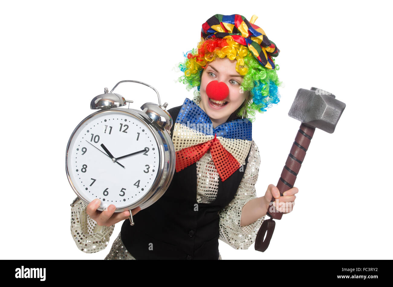 Female clown with alarm-clock and hammer isolated on white Stock Photo ...