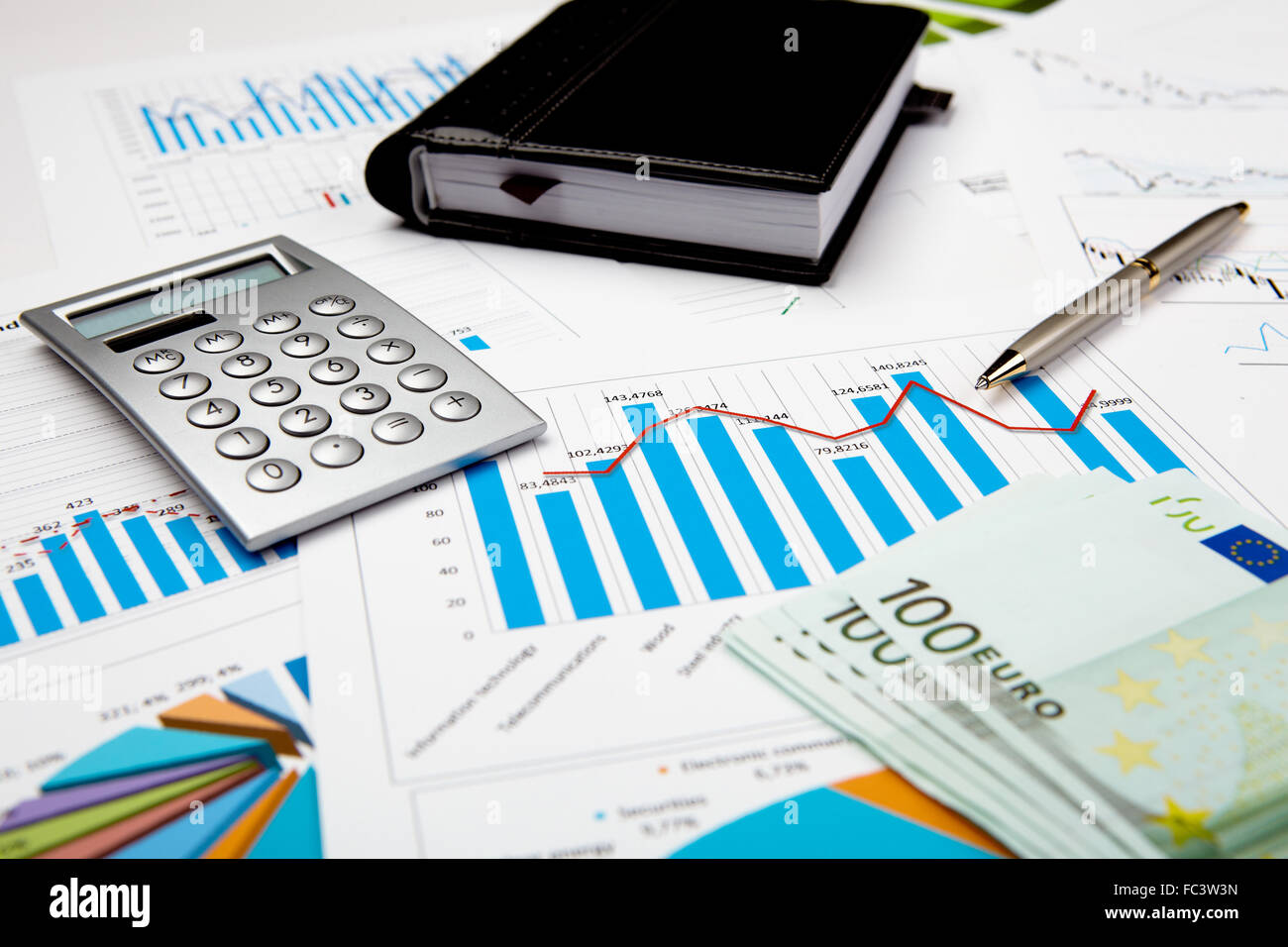 financial charts and graphs on the table Stock Photo - Alamy