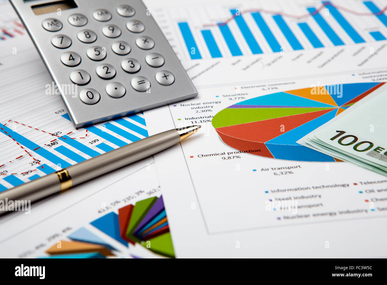 financial charts and graphs on the table Stock Photo - Alamy