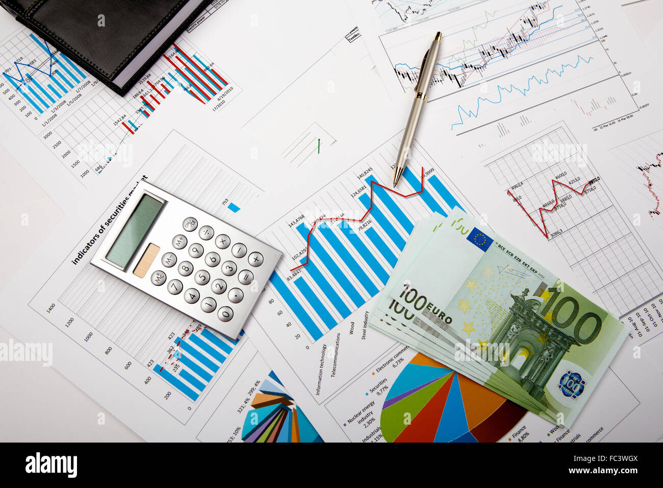 financial charts and graphs on the table Stock Photo - Alamy