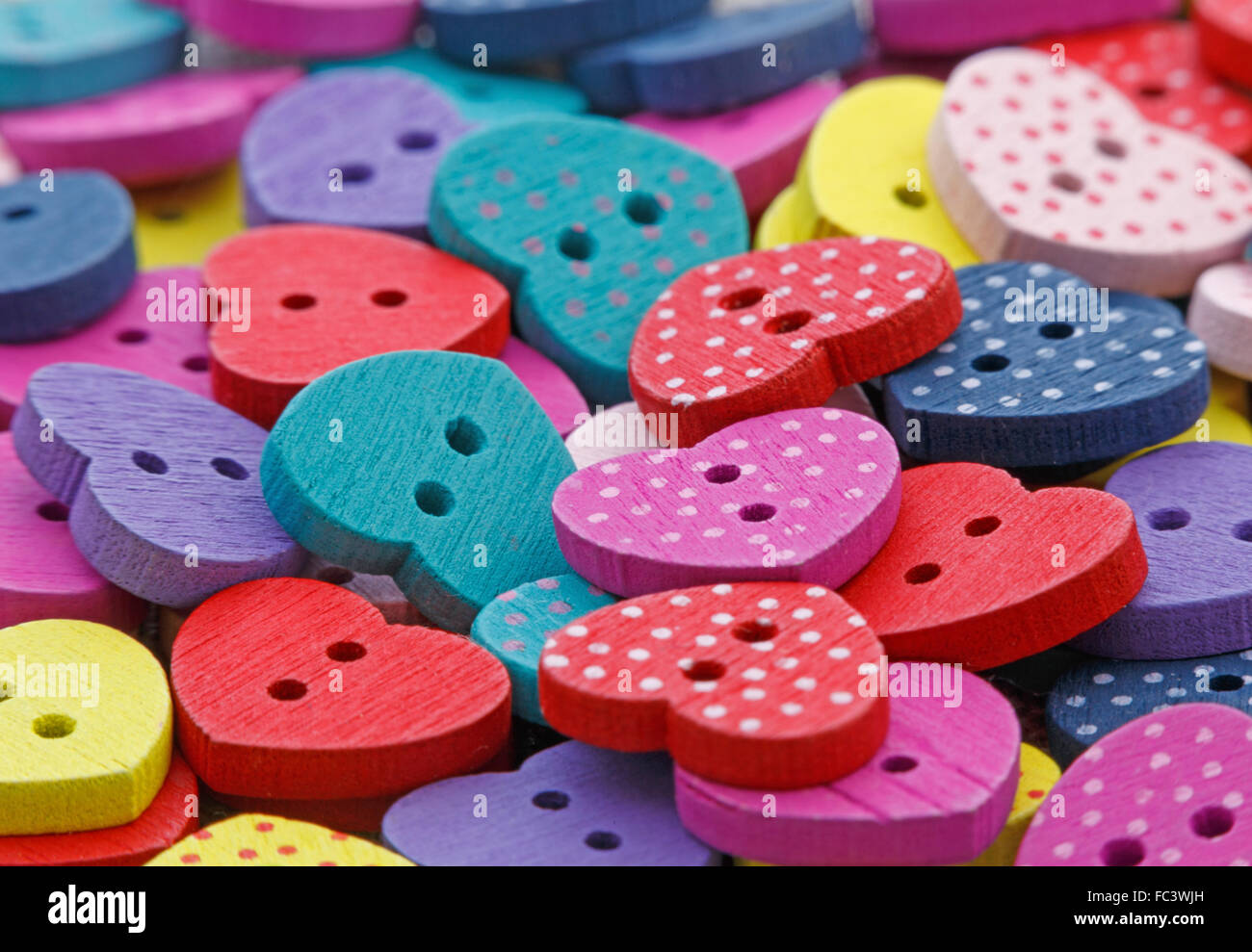 close up of wooden heart shaped buttons Stock Photo - Alamy