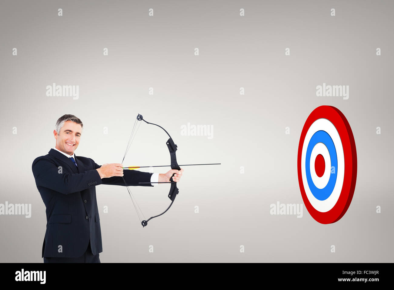 Composite image of smiling businessman stretching a bow Stock Photo - Alamy