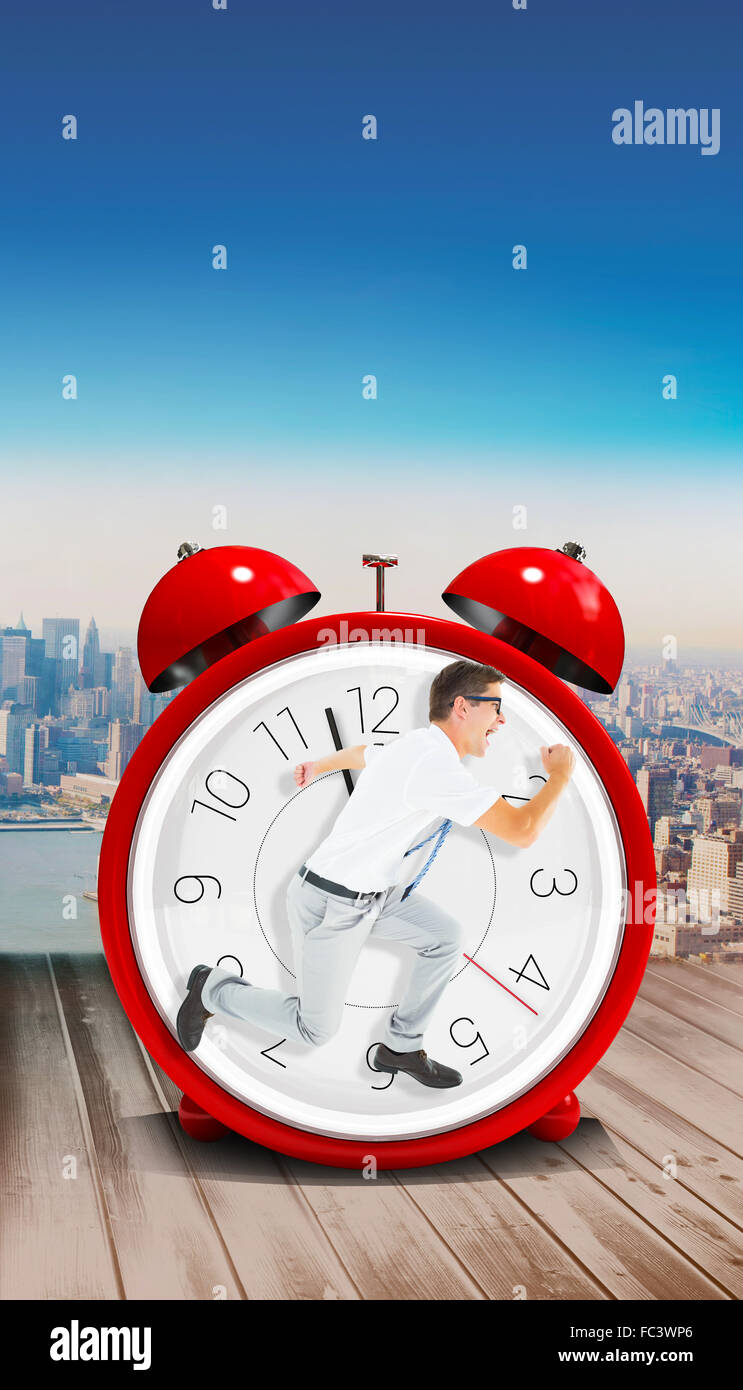 Composite image of geeky happy businessman running mid air Stock Photo ...