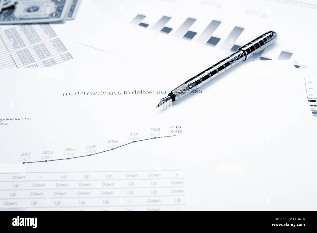 financial charts and graphs on the table Stock Photo - Alamy