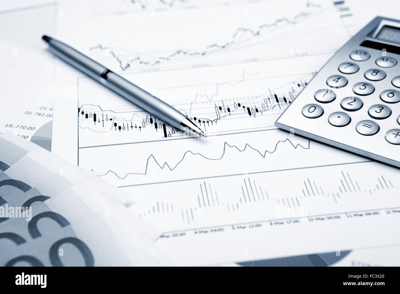financial charts and graphs on the table Stock Photo - Alamy