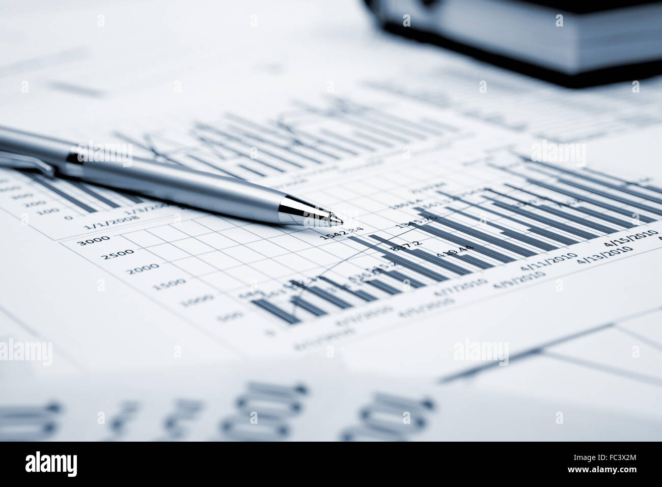 financial charts and graphs on the table Stock Photo - Alamy