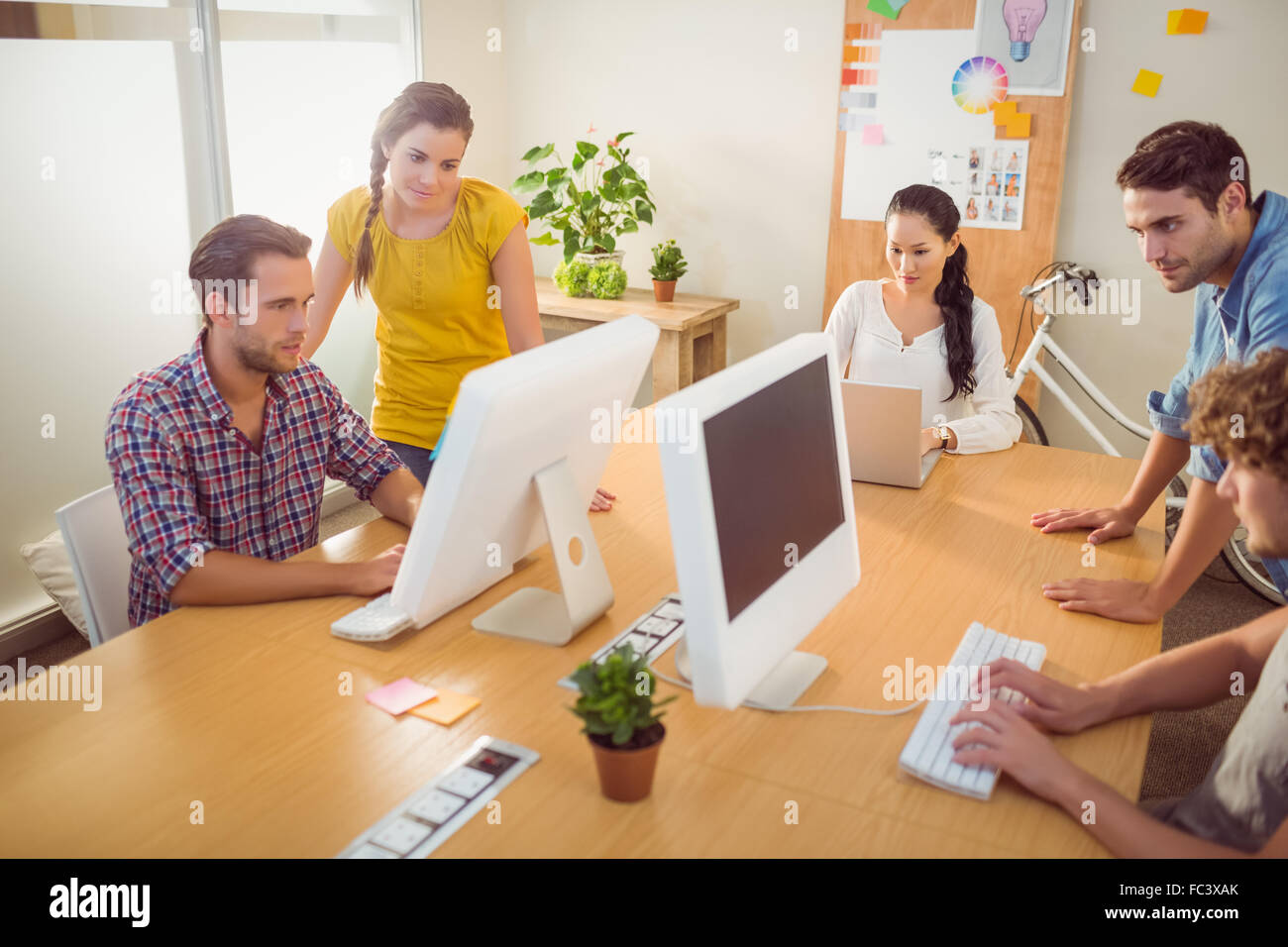 Creative team sitting table laptops hi-res stock photography and images ...