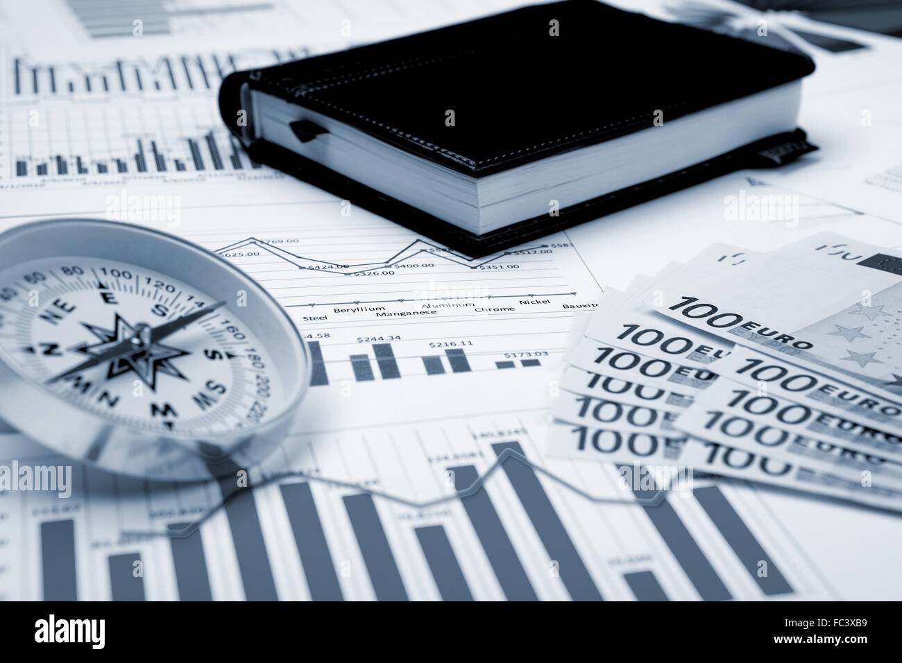 financial charts and graphs on the table Stock Photo - Alamy