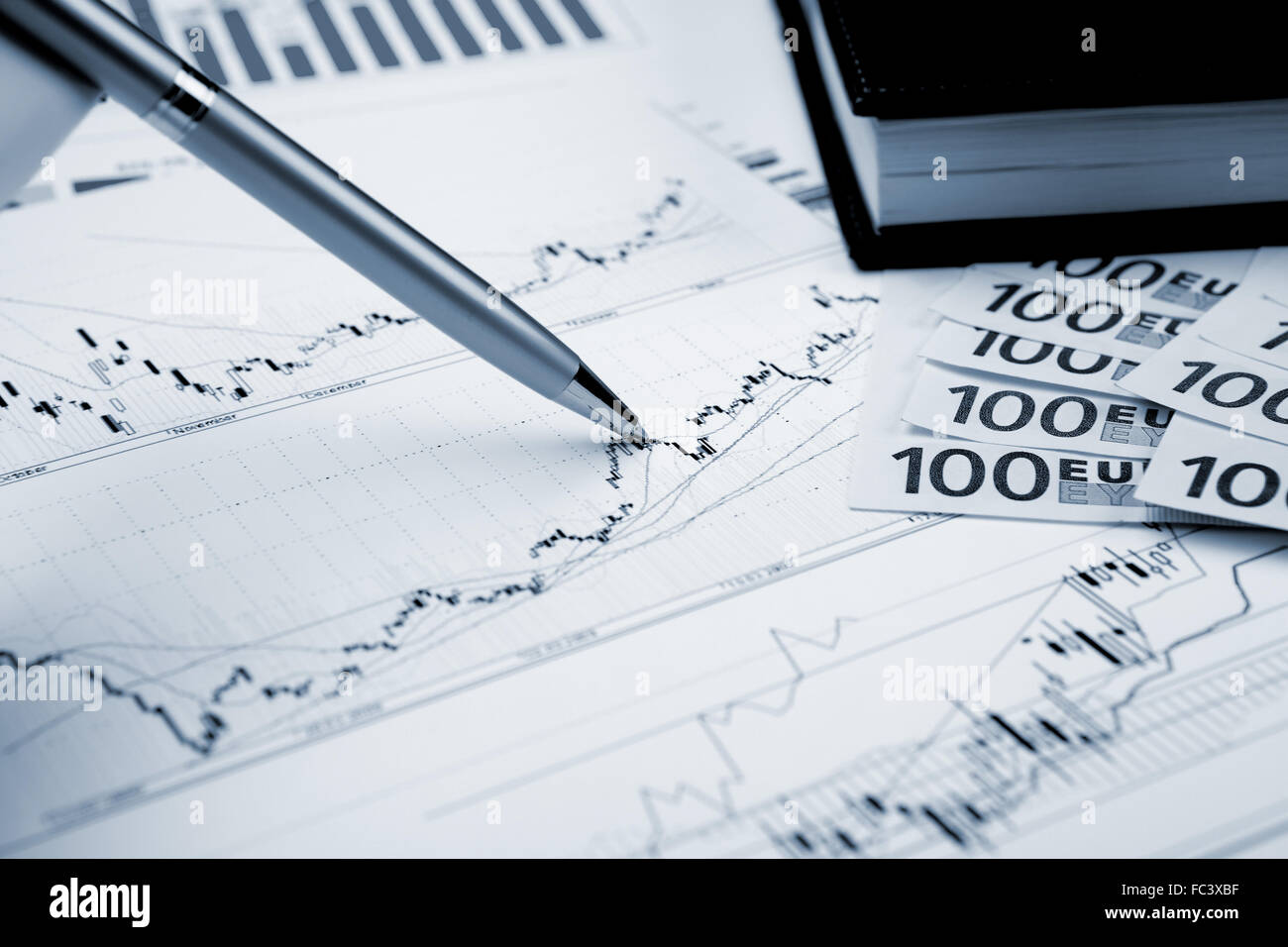 financial charts and graphs on the table Stock Photo - Alamy